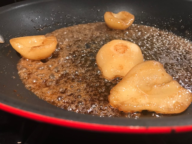 Simple and Decadent Pears Foster with Vanilla Ice Cream